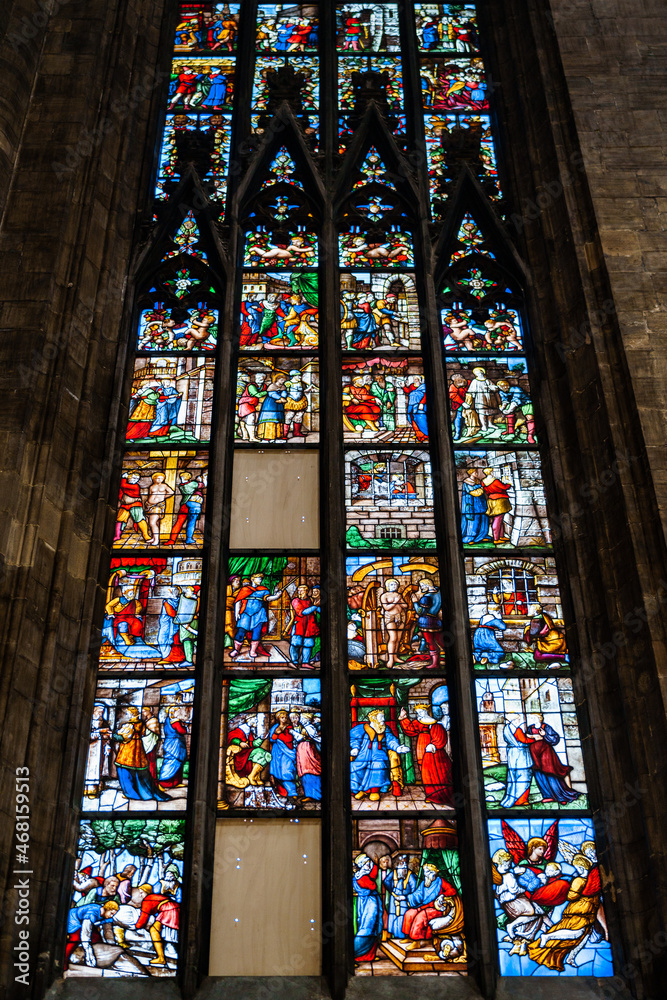 Tall stained glass window of the Duomo. Italy, Milan Stock Photo ...