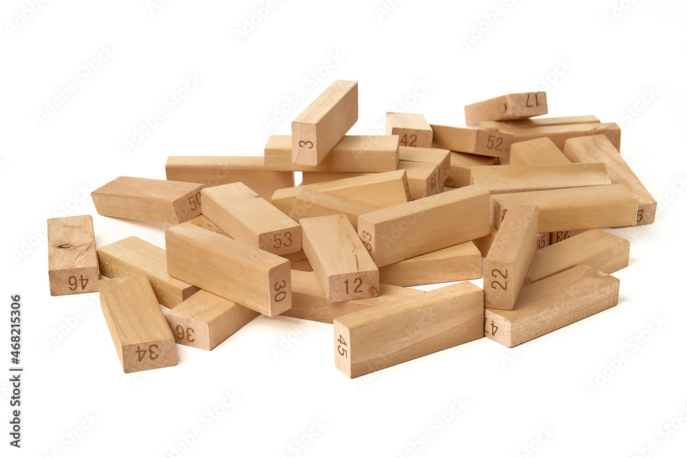 Numbered wooden blocks of the Jenga Tower board game on a white ...