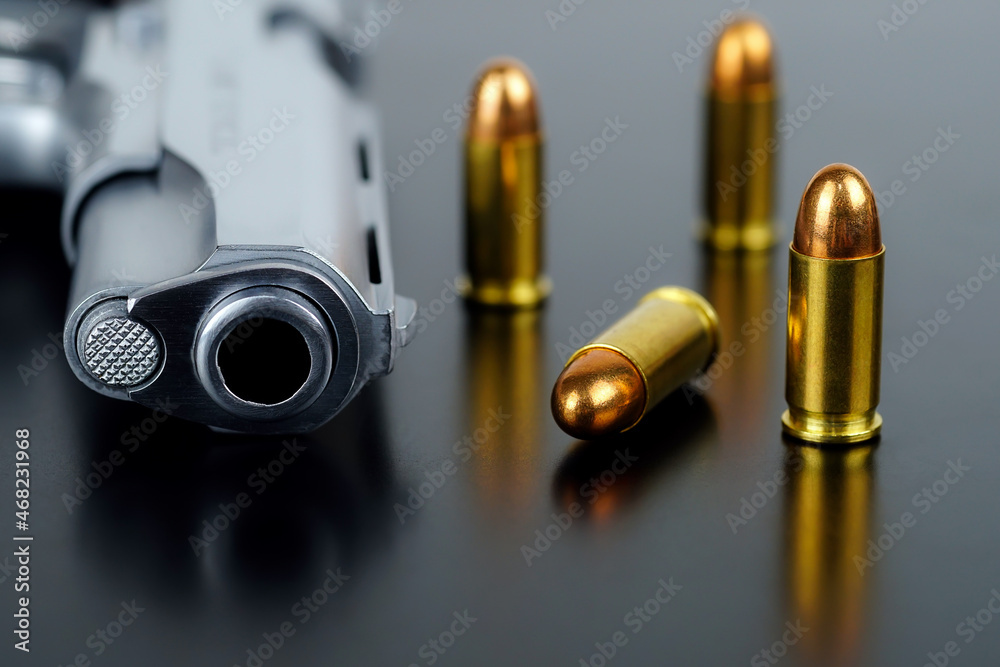 Short pistol and ammunition Put on a black background, pistol with ammo ...