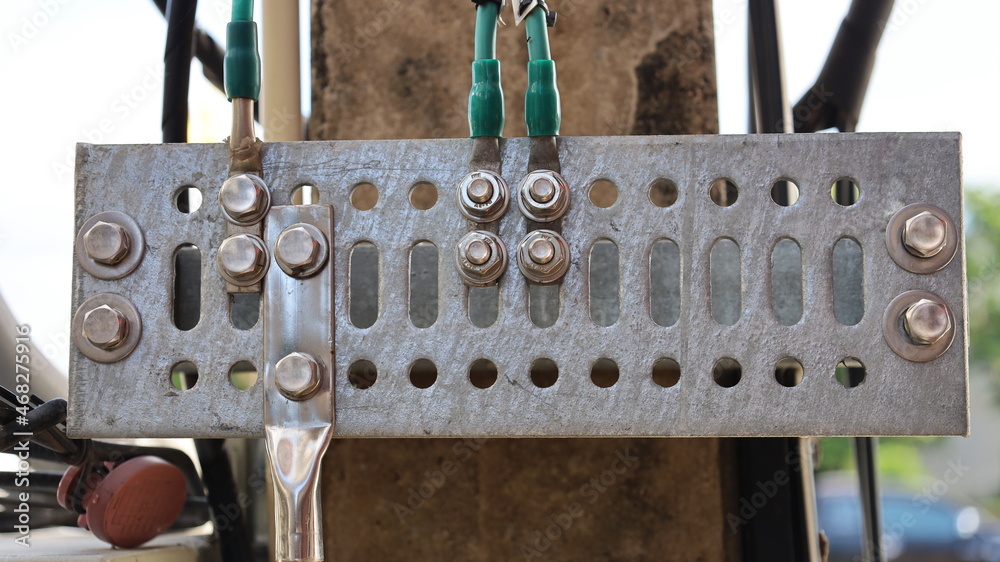 Ground bar with earth wire cable on pole. The lightning protection ...