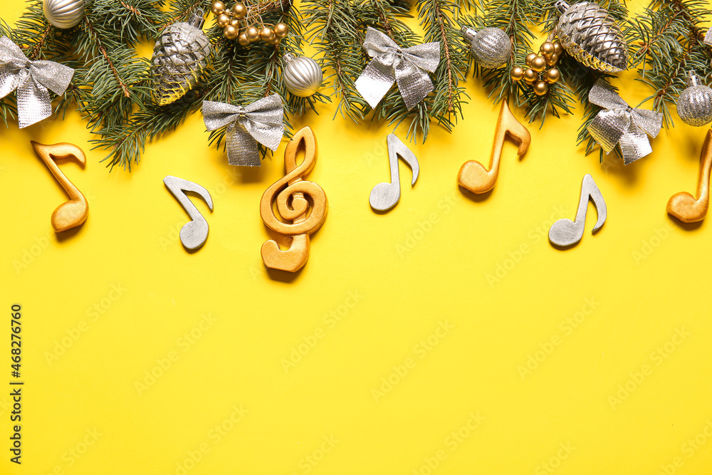 Note signs with Christmas decor and fir branches on yellow background ...