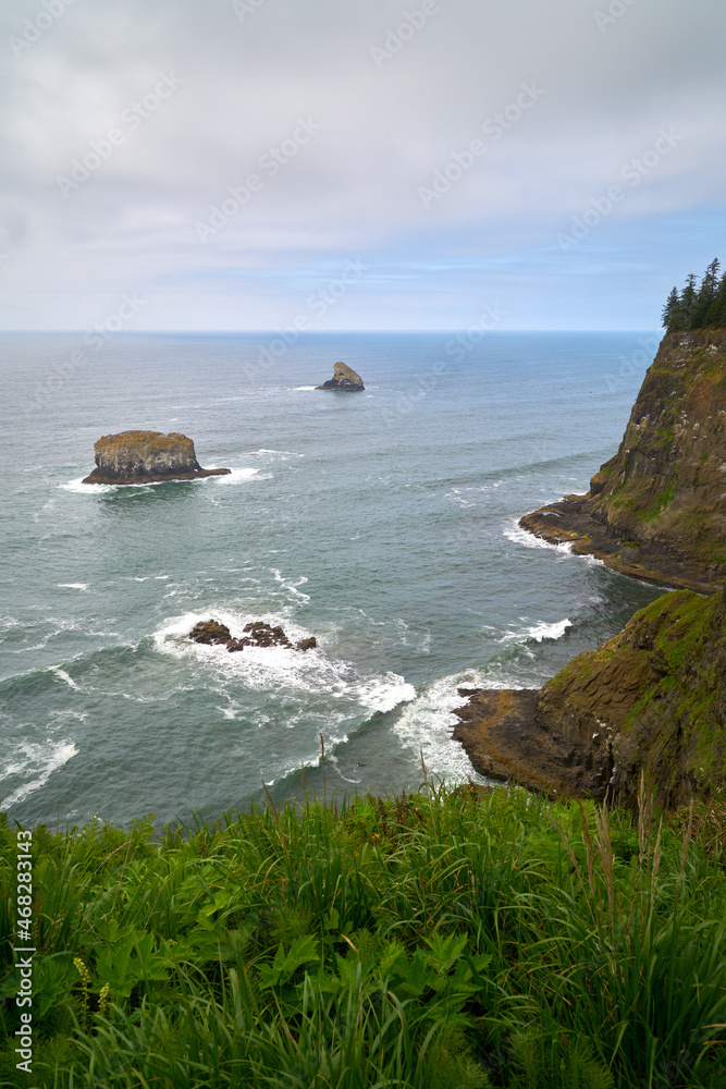 Pillar Rock and Pyramid Rock off Cape Meares vertical. The view of ...