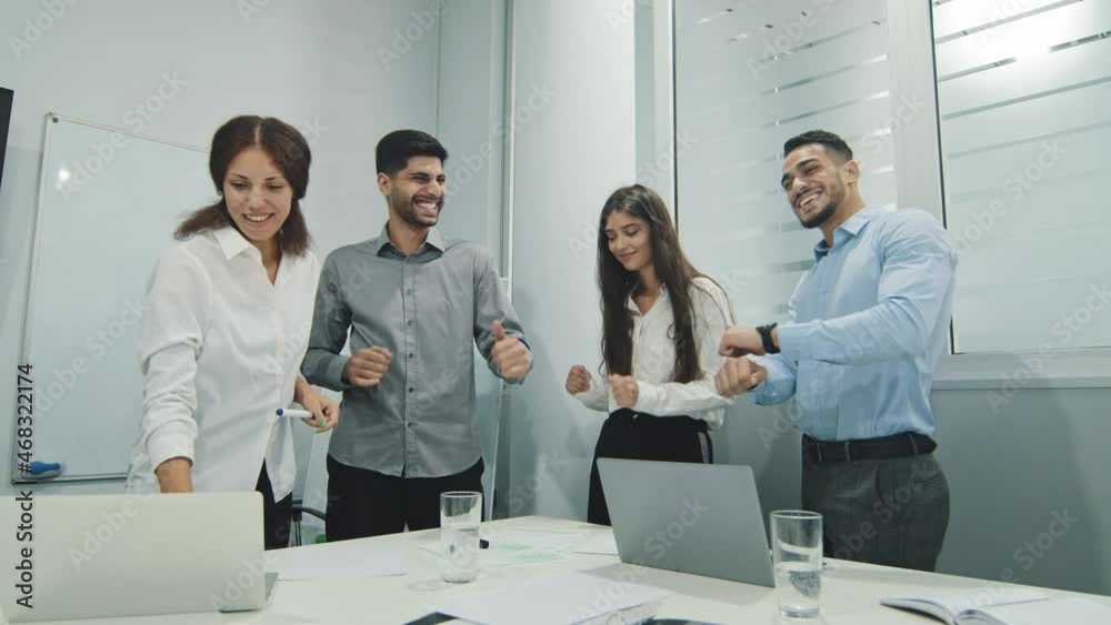 Excited motivated successful diversity colleagues joying and ...
