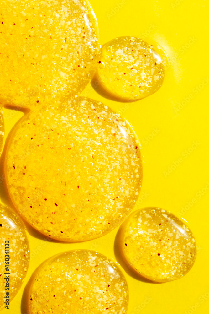 Cosmetic serum or scrub swatch on Yellow background. Transparent fluid ...