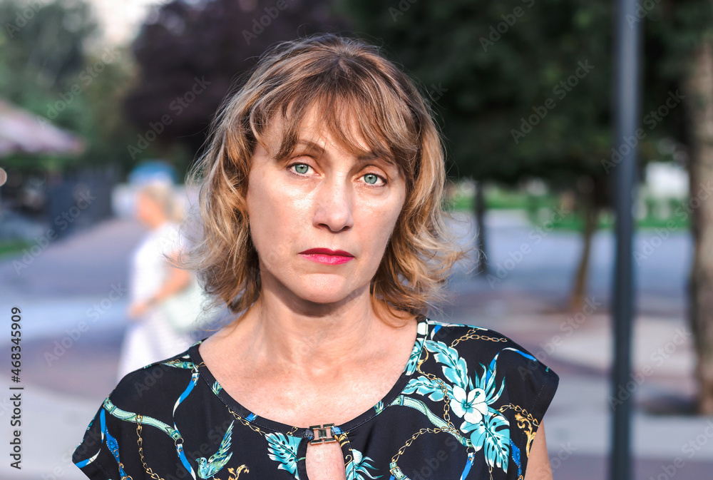 portrait of a beautiful mature woman of middle age 50 years old with ...