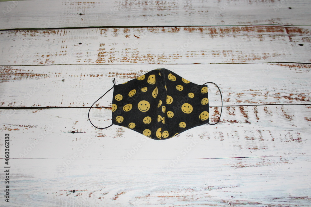 Smiley faces on a covid 19 face mask Stock Photo | Adobe Stock