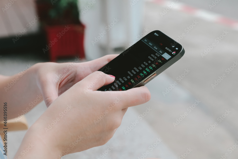 hand holding mobile phone Stock Photo | Adobe Stock