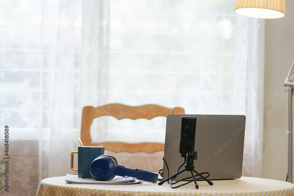 table desk with laptop and microphone. communication technology ...