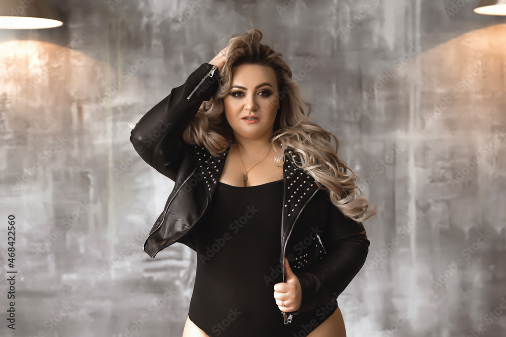 Plus Size Woman With Long Blond Hair In A Leather Jacket Overweight