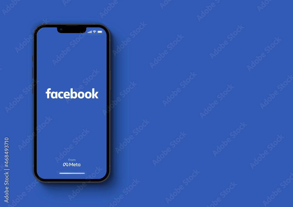 Facebook app from Meta on smartphone iPhone 13 Pro screen on blue ...