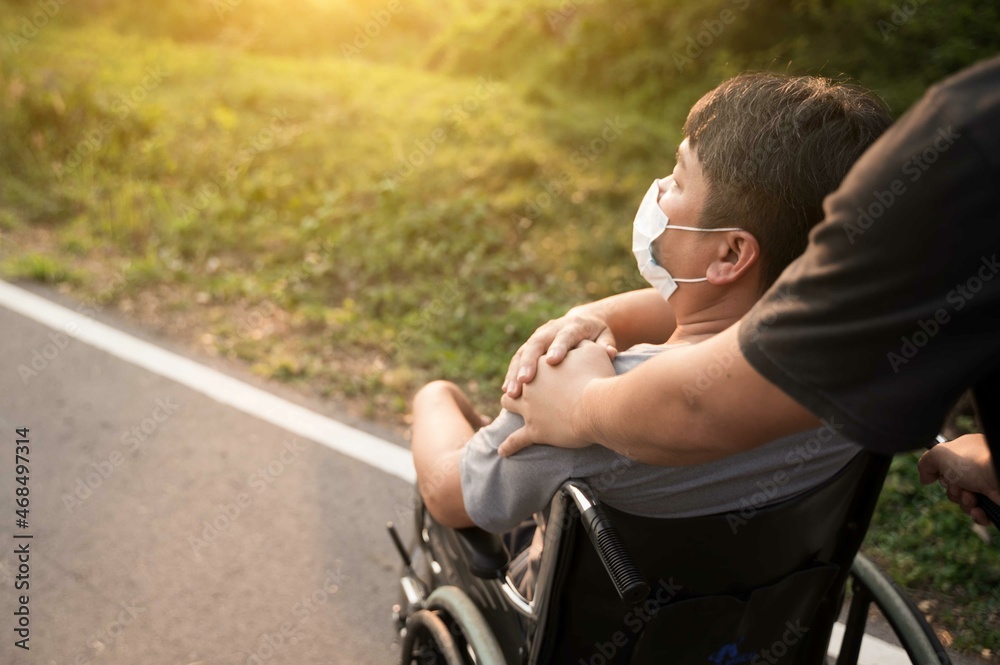 Paralyzed,disabled or handicapped man sitting relax on a wheelchair in ...