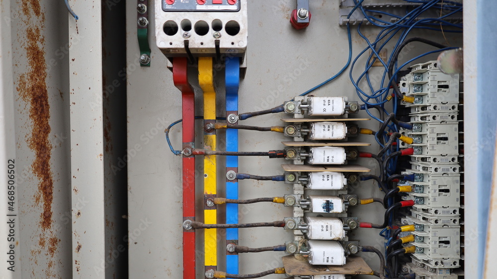 Equipment in an old metal control cabinet. Close up details of the ...