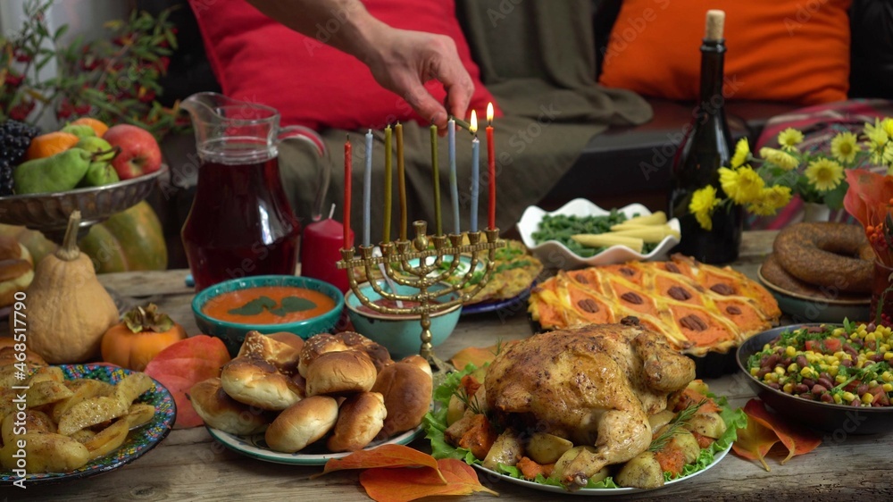 Lighting the Menorah lights. Menorah candles. Festive Hanukkah dinner ...
