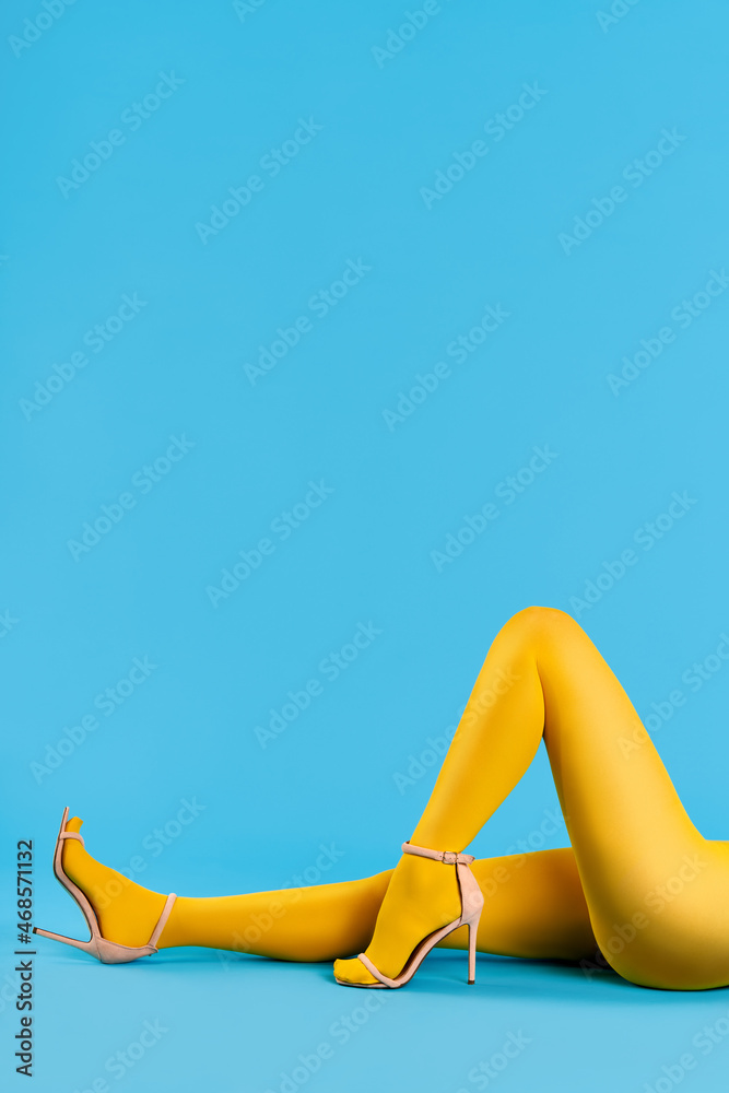 Legs Of Beautiful Young Woman Wearing Bright Yellow Tights And High