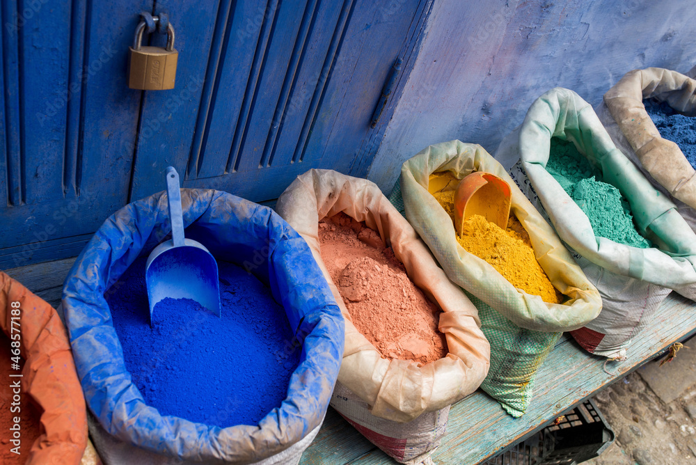 Typical colored pigments to paint the walls of the house in a store ...