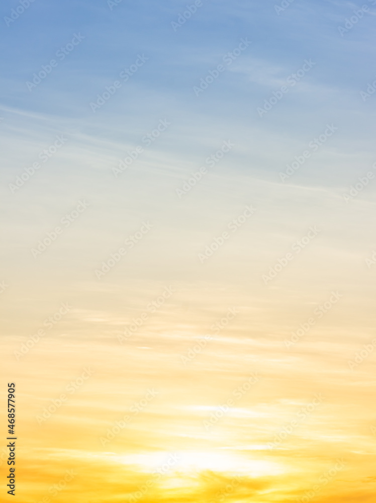 Sunset sky vertical with golden orange sunrise clouds background in the ...