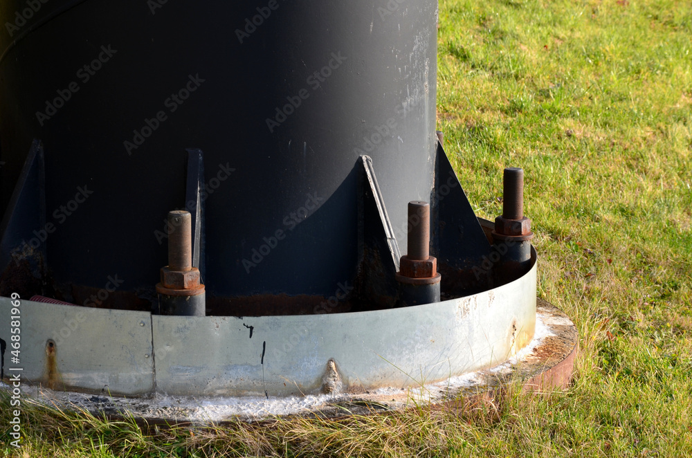 black steel column, beam, bolted with massive large screws to the ...