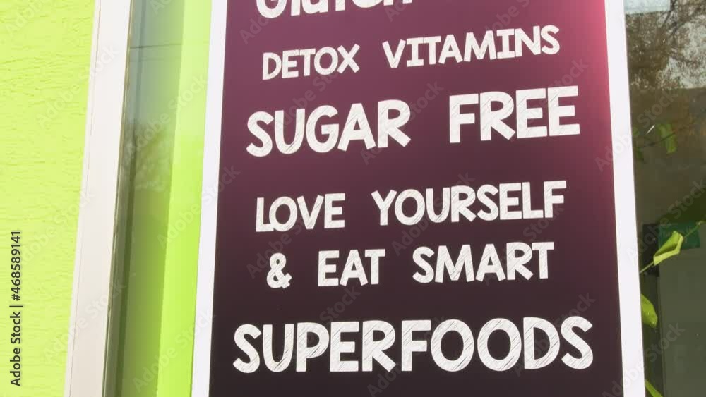 Billboard on healthy foods store facade with inspirational quotes ...