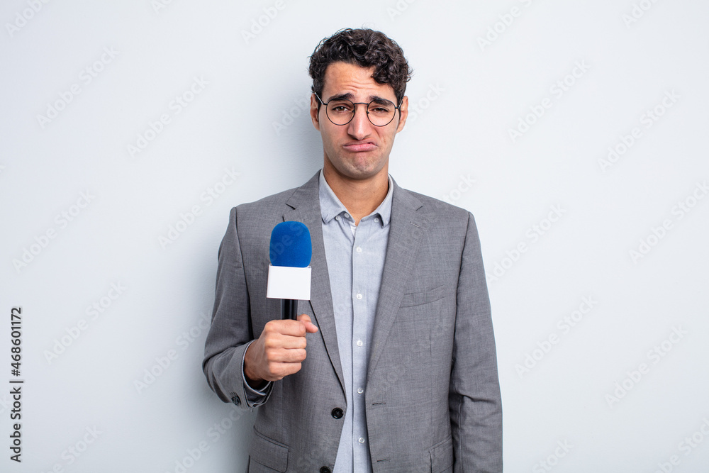 young handsome man feeling sad and whiney with an unhappy look and ...