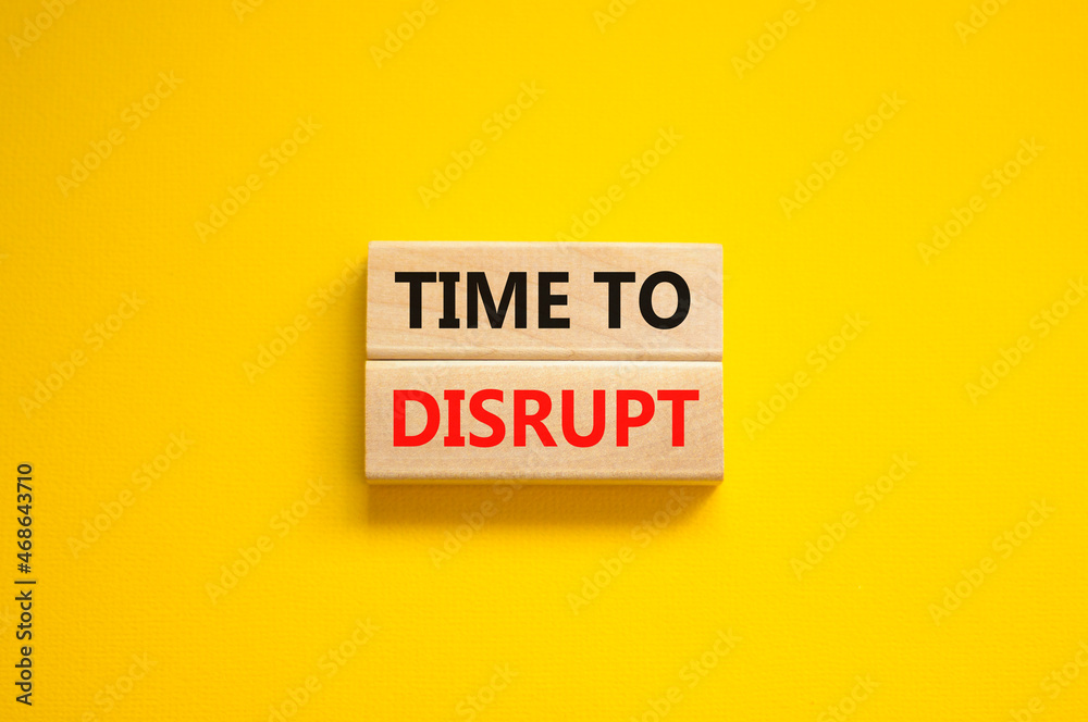 Time to disrupt symbol. Concept words Time to disrupt on wooden blocks ...
