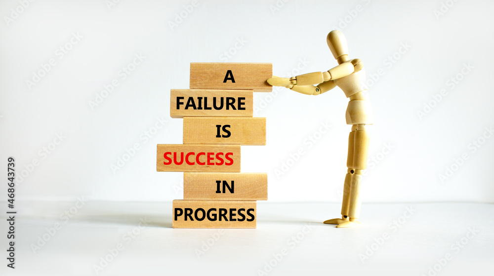 Failure or success symbol. Wooden blocks with words A failure is ...