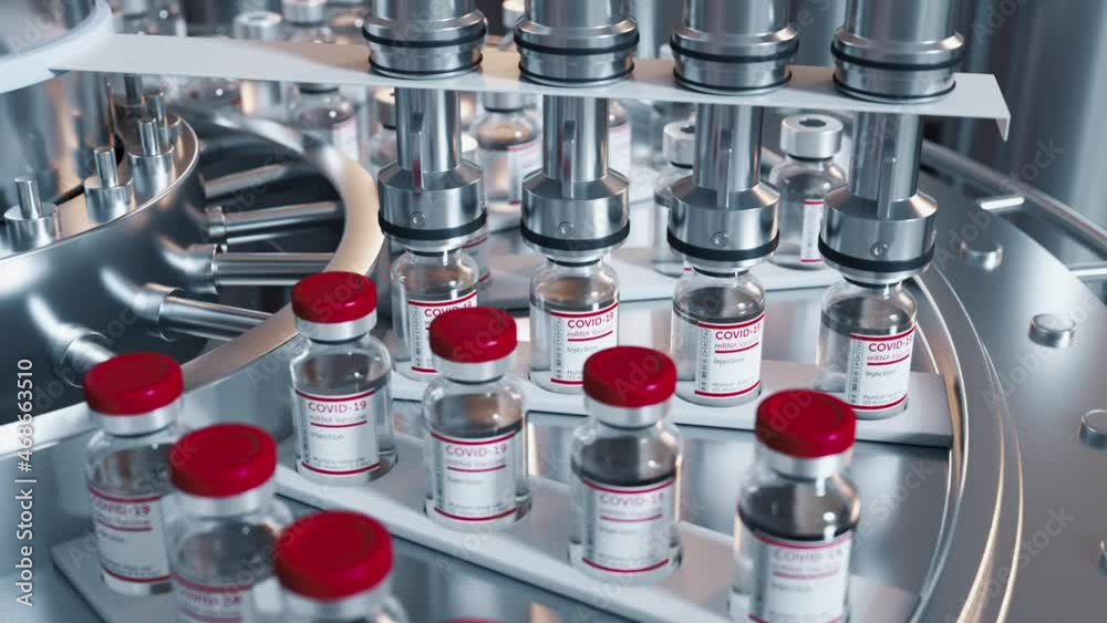 Sars-COV-2 COVID-19 coronavirus vaccine mass production. Machine puts ...