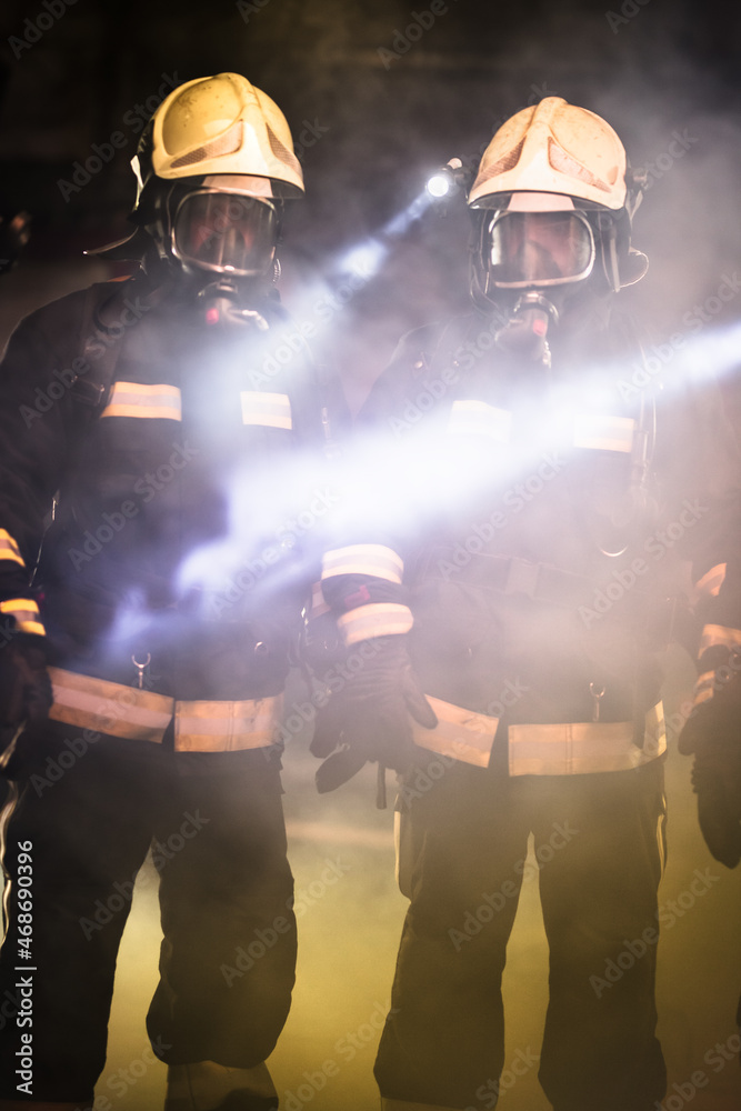 Group of professional firefighters. Firemen wearing uniforms ...