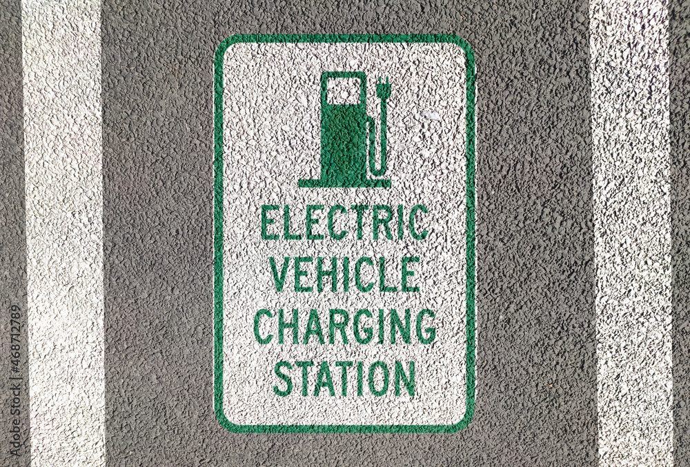 Electric vehicle charging station point marked on road symbol Stock ...