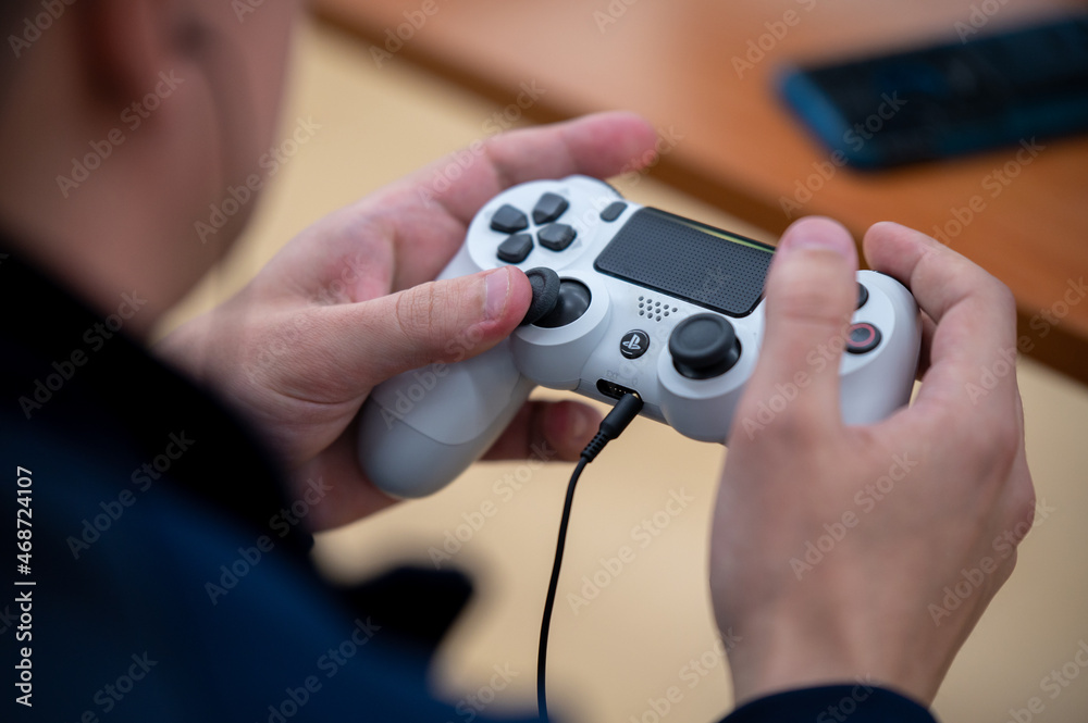 Focus on Hands, Keyboards and Mouse. Back view of young gamer playing ...