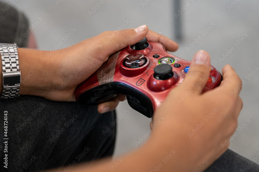 Focus on Hands, Keyboards and Mouse. Back view of young gamer playing ...