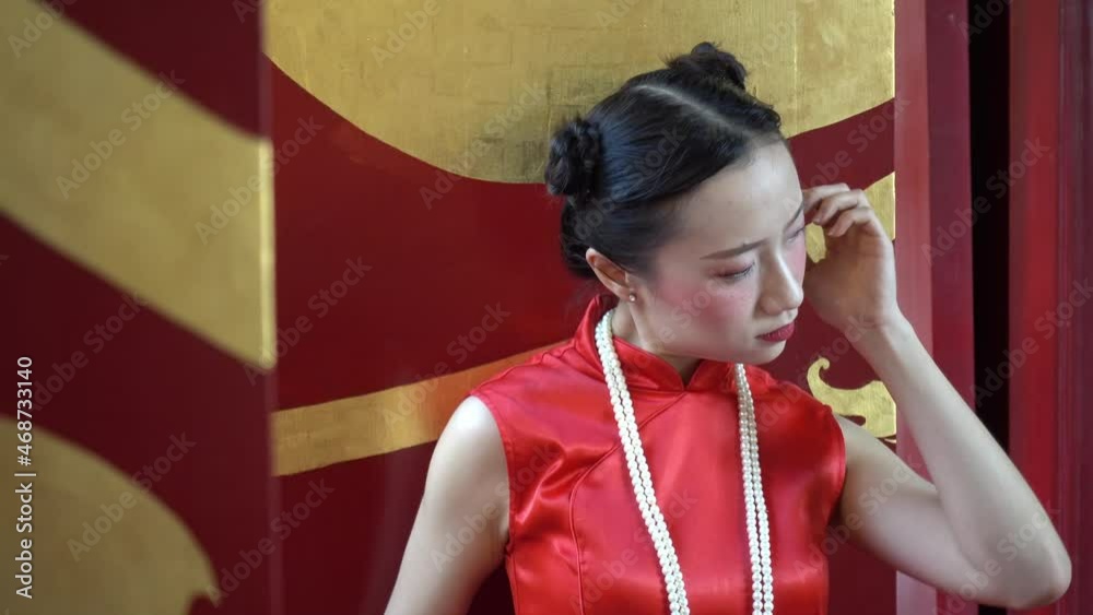 portrait footage of a Chinese Model wearing Red traditional cheongsam ...