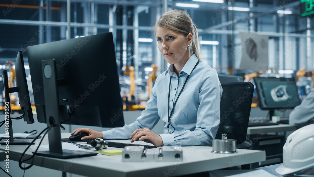 Car Factory Office: Portrait of Confident Female Chief Engineer Working ...