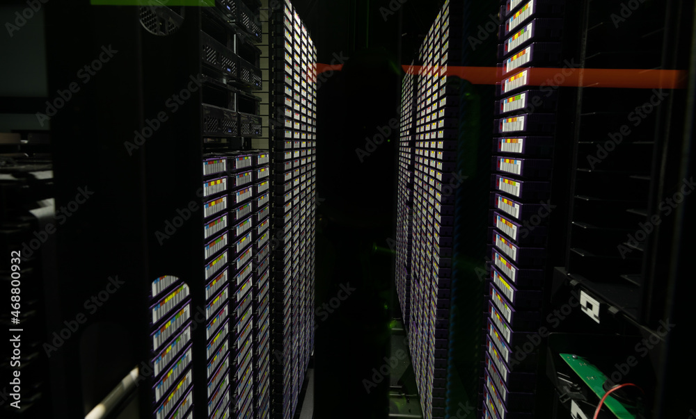 Foto de Data center with multiple rows of fully operational server ...