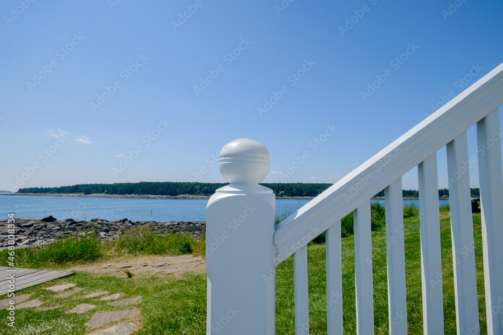 White wooden railing of the steps leading up to the light keepers ...
