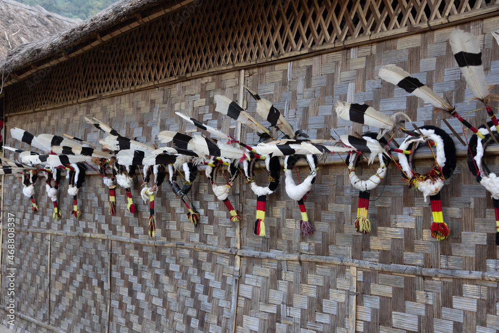 Traditional Naga head gear made of Hornbill feathers hanging on the ...