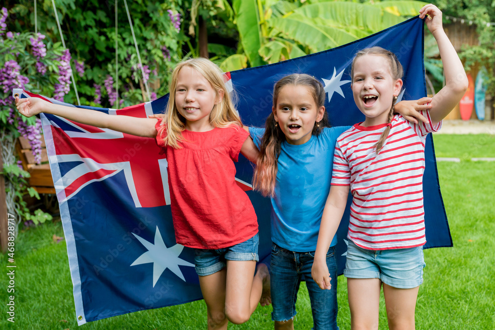 National day of Ausralia. Happy patriotic girls holding waving flag of ...