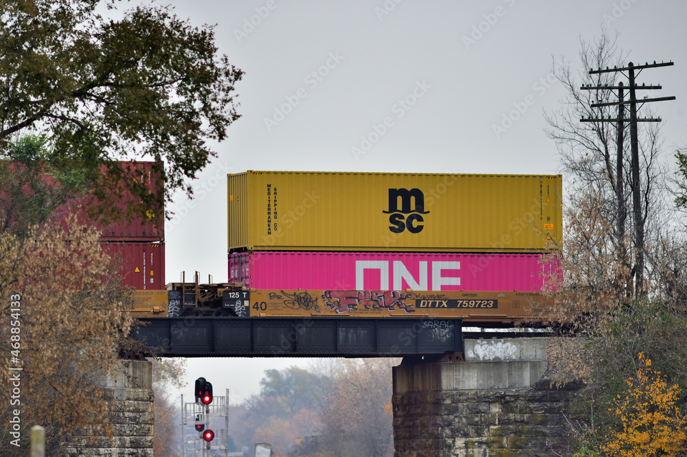 Intermodal freight train that contains recognizable logos on its ...