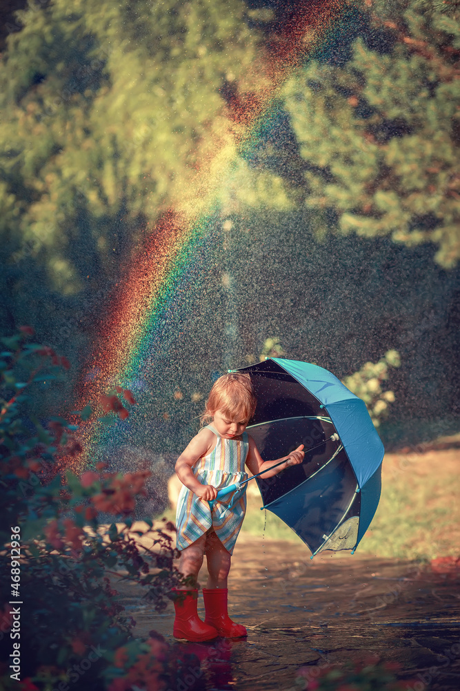 Little cute girl with blue umbrella under beautifully lighted summer ...