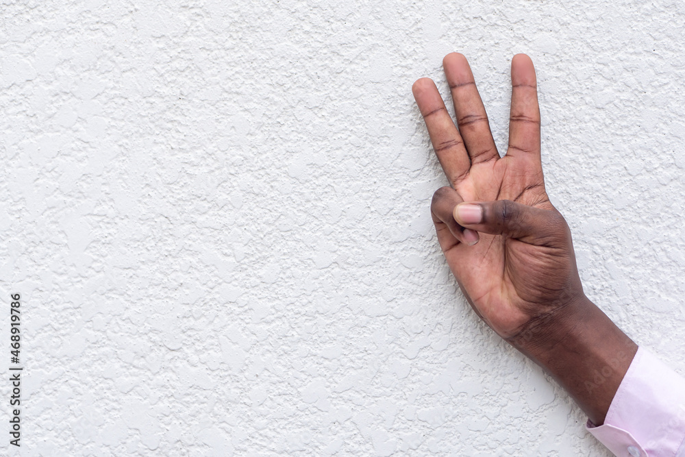 Black African man hand pointing three fingers up Stock Photo | Adobe Stock
