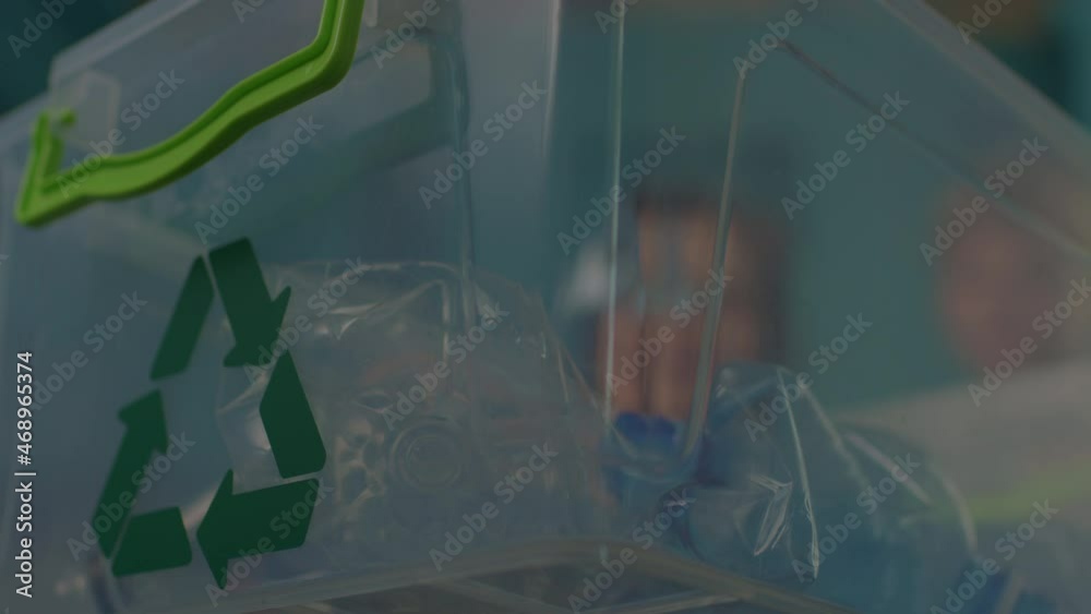Plastic container with green recycle sign and falling plastic bottles ...