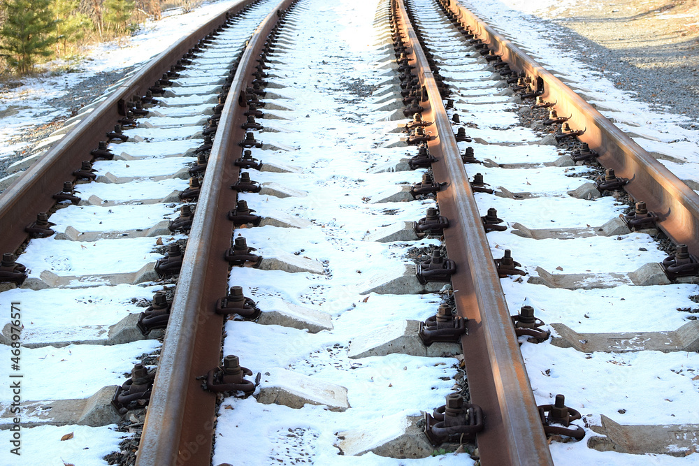 Image of an empty railroad track stretching far away. Crossing railway tracks. Narrow gauge ...