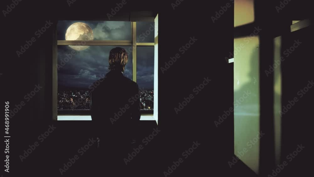 Man Looking Full Moon Over City Buildings From Inside Apartment, Zoom ...