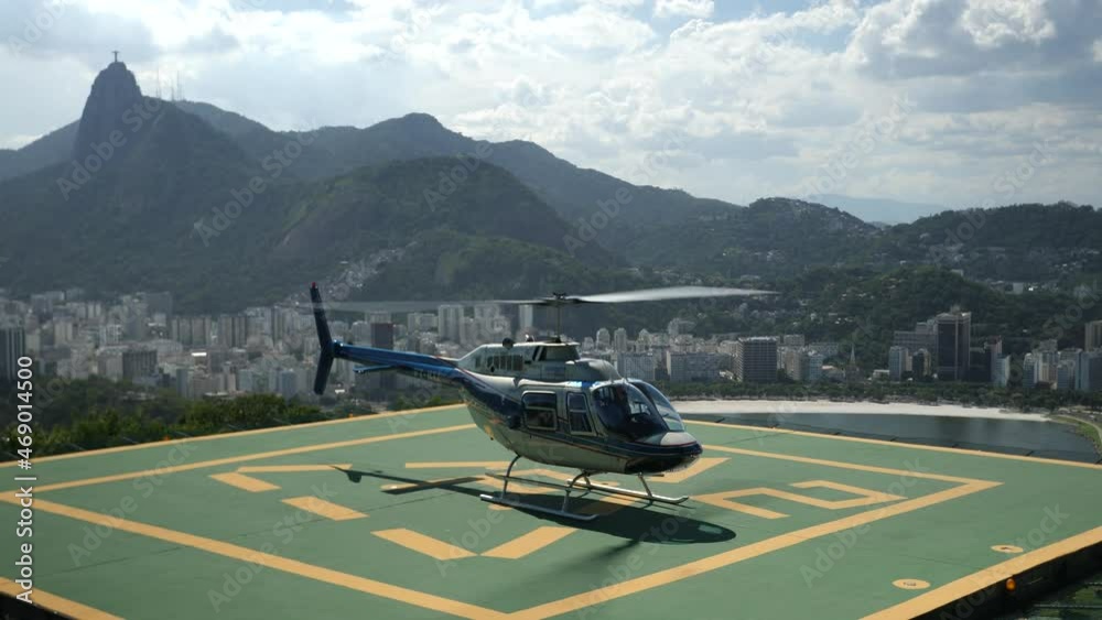 Helicopter is landing. Helicopter descending to helipad from the top of ...