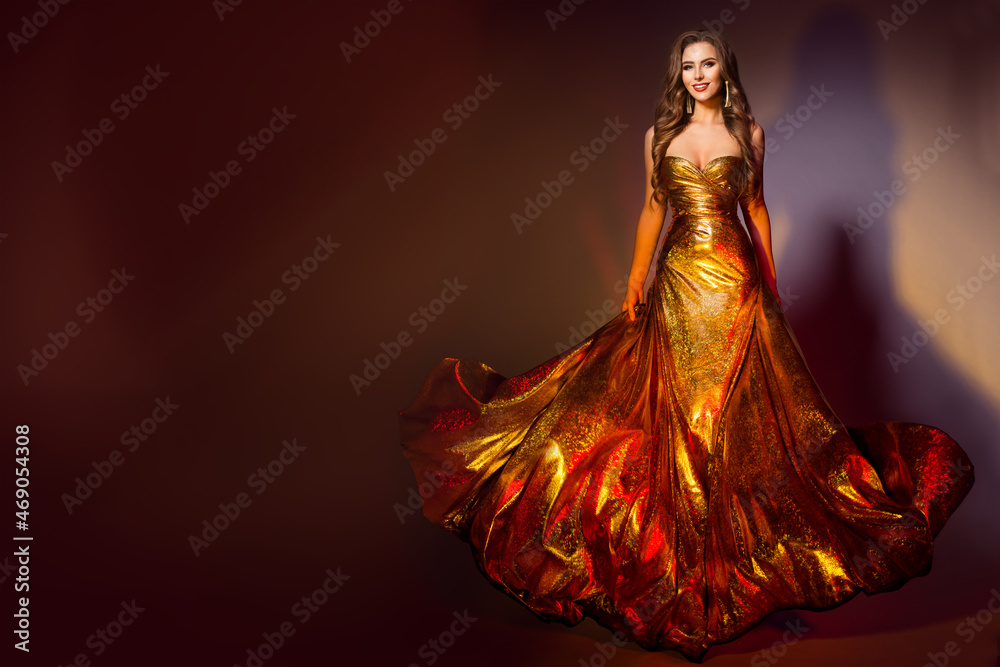 Fashion Model in Long Golden Dress. Smiling Beauty Woman in Evening ...