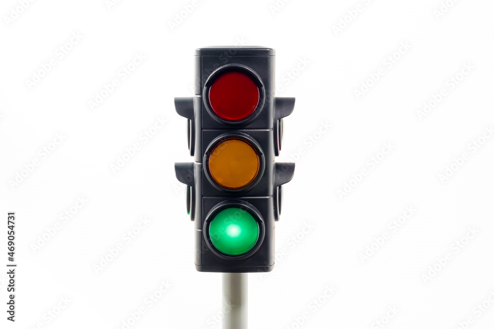 Isolated traffic light showing an illuminated green light. Concept ...