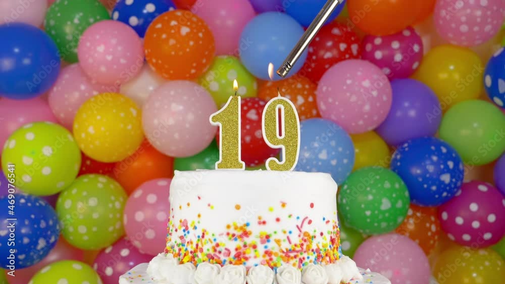 Birthday cake with candles number 19. Cake on a bright festive ...