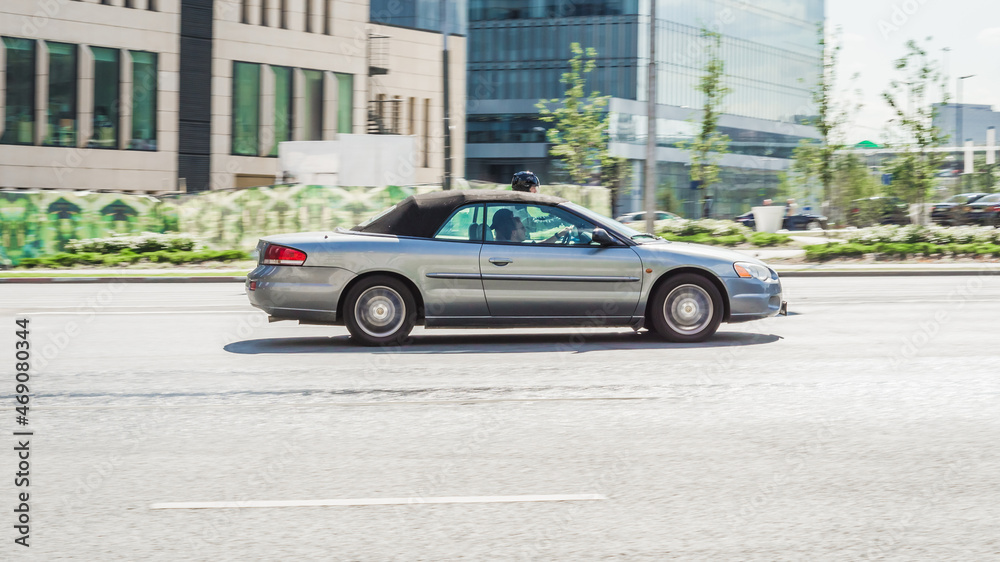 Chrysler Sebring convertible car on the road in motion. Fast speed ...