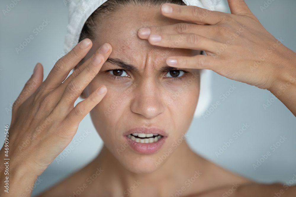 Close up head shot portrait of stressed young mixed race hispanic woman ...
