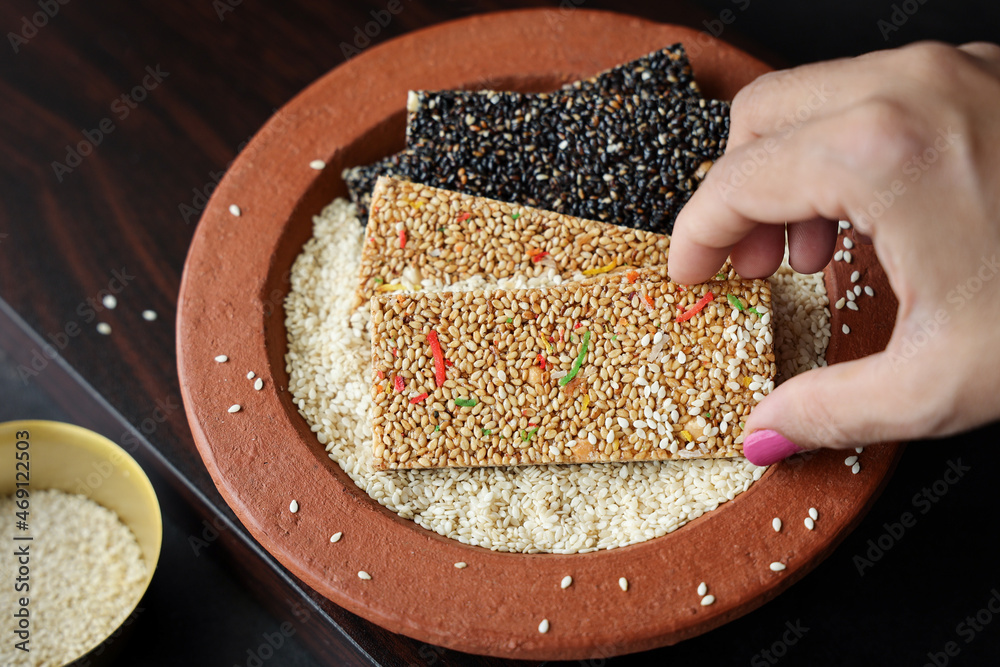 Til chikki peanut chkki Murmura ladoo laddu Revdi popcorn Indian ...