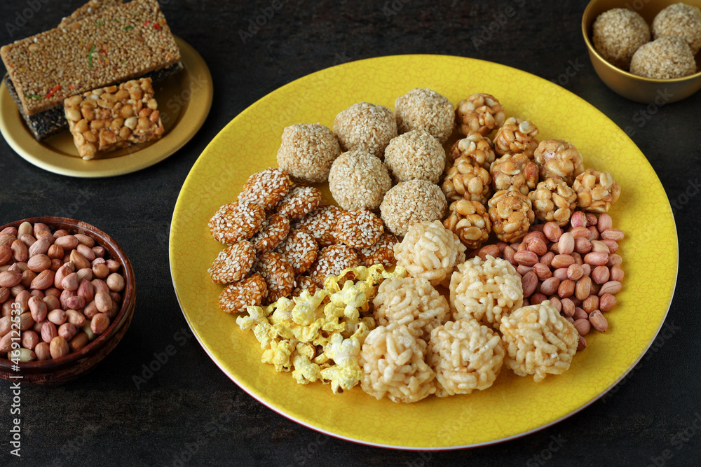 Til chikki peanut chikki Murmura ladoo laddu Revdi popcorn Indian ...